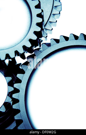 Metal cog wheels bonding together Stock Photo - Alamy