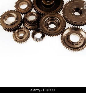 Steel cogs together on plain background Stock Photo - Alamy