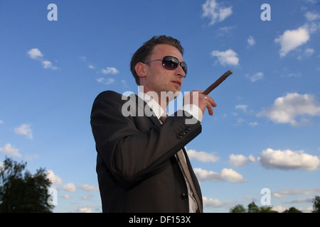 Berlin, Germany, man smoking a cigar Stock Photo - Alamy