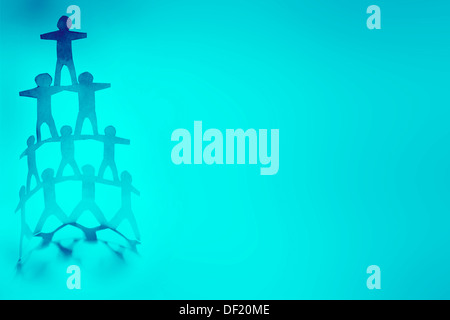 Human pyramid paper doll people Stock Photo - Alamy