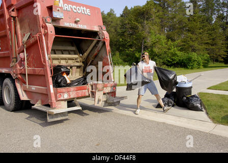 Residential trash collection crew pick up waste products Stock Photo ...