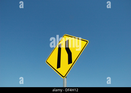 Lane ends Merge Left Traffic Signs Stock Photo - Alamy