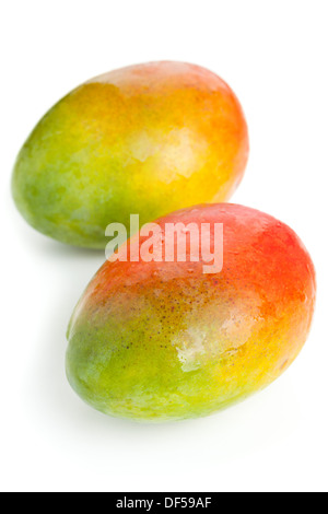 Sweet tasty yellow mango over wooden background Stock Photo - Alamy