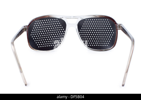 Pinhole glasses, also known as stenopeic glasses, are eyeglasses with a ...