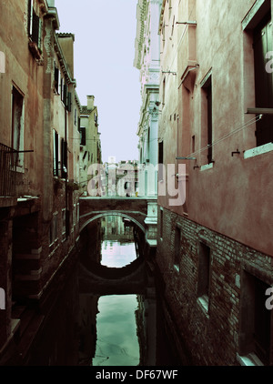Small canal and bridge between houses in Venice, Italy Stock Photo - Alamy