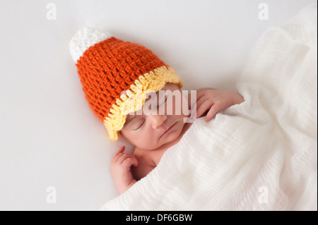 Little sleeping newborn baby, wearing Santa hat Stock Photo - Alamy