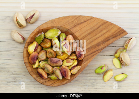 Pistachio nuts with and without shell in wooden bowl, close up Stock ...
