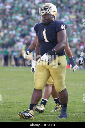 Notre Dame defensive lineman Louis Nix runs a drill at the NFL football ...
