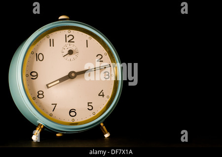 Analog alarm clock showing eight o'clock, 8pm or 8am isolated on white ...