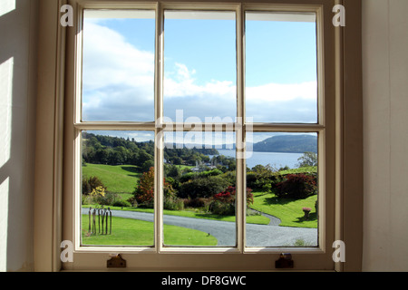 View through open sash window through to sunny garden terrace Stock ...
