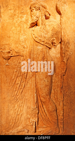 GREEK ART. GREECE. Votive relief representing Demeter sitting on a ...