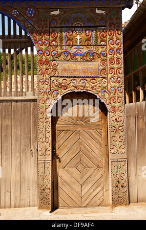 Traditional folk art wooden Szekely gates in a Szekely village near ...