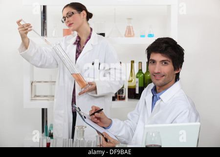 Oenologists analysing different wines Stock Photo - Alamy