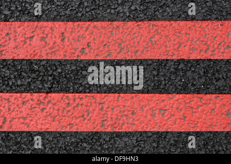 Double red line road markings on a UK road Stock Photo - Alamy