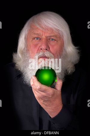 Glass sphere fortune telling with man hand Stock Photo - Alamy