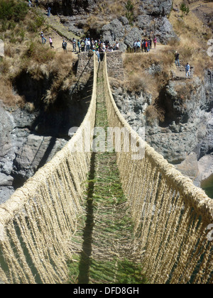 Qeswachaca Inca Bridge, a traditional woven grass rope bridge across ...