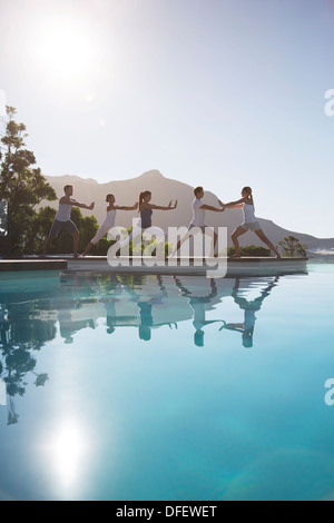 People practicing tai chi poolside Stock Photo - Alamy