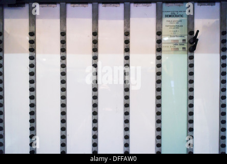 A mechanical voting machine in New York City displays the name of NY ...