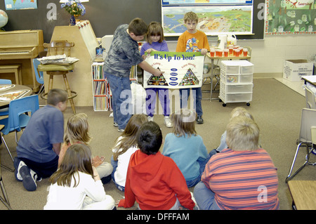 Elementary 3rd grade students listen to children's author Derrick Stock ...