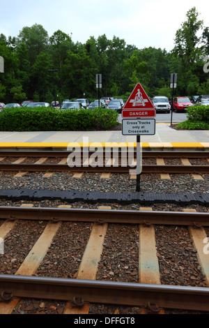 Cross tracks only at crosswalks sign next to pedestrian crossing, Falls ...