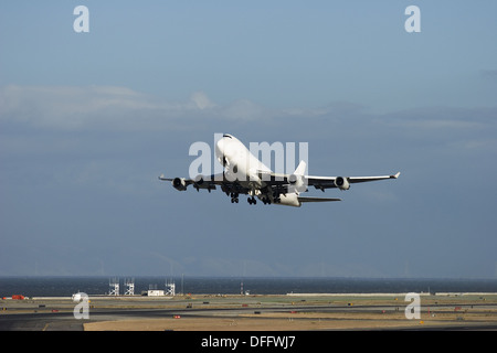 An unmarked, all white, Boeing 747 Jumbo jet approaches landing at LAX ...
