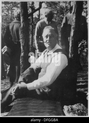 President Franklin Roosevelt ,center, is shown above with army officer ...