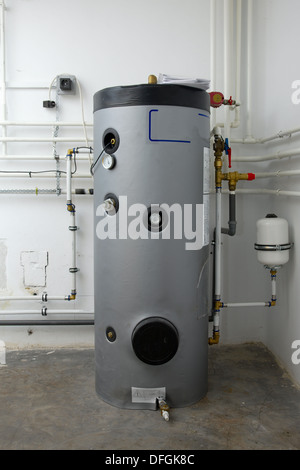 Interior of industrial building with big boiler or reservoir under ...