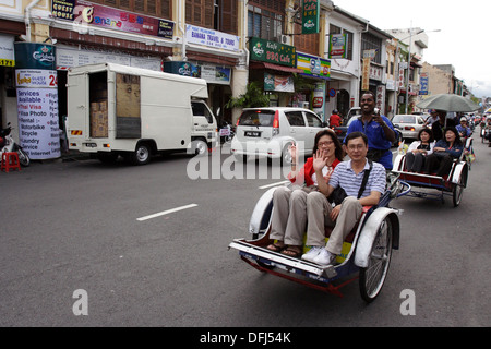 A Rickshaw Ride in the Streets of Georgetown, Penang Stock Photo - Alamy
