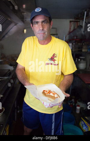 Richard Messier prepares a lobster roll on his High Tide Lobster Food ...