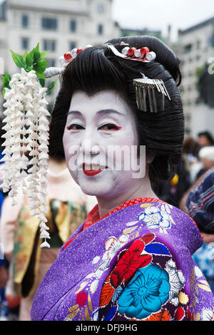 Close-up portrait of Japanese geisha doll in traditional costume ...