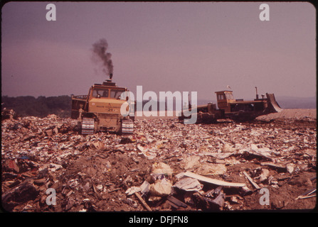 GARBAGE IS SPREAD AND COMPACTED IN LANDFILL OPERATION AT CROTON DUMP ...