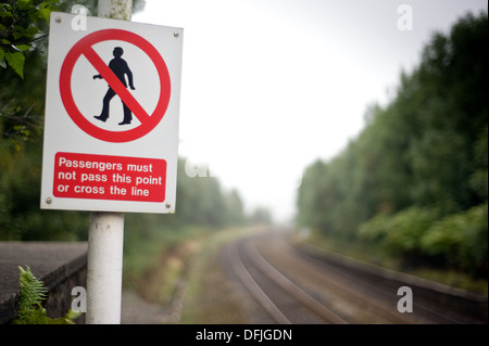 Passengers must not pass this point or cross the line warning sign ...