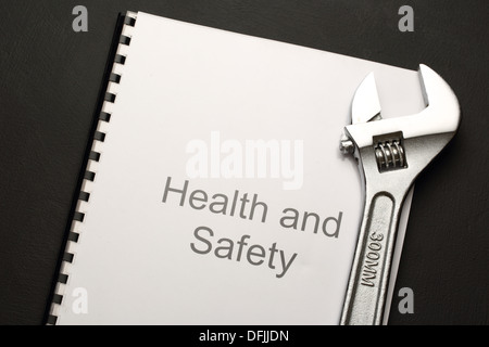 Health and safety register with spanner Stock Photo - Alamy