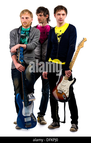 Portrait of musical group of three guys and one girl in Recording ...