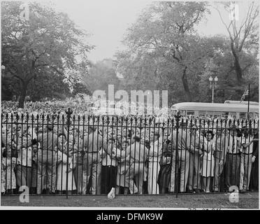 A photograph of large crowds gathered outside or inside the ...