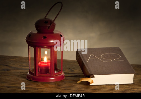 Red lantern with bible on the wooden desk Stock Photo - Alamy