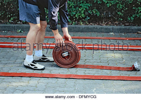 Man rolls Fire Hose Roll Firefighting Equipment Fire Drill, Sabang ...