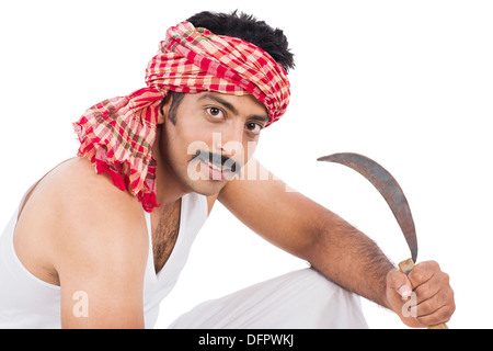 Happy Indian farmer Holding sickle and Paddy crop in hand - Concept good crop yields due to ...