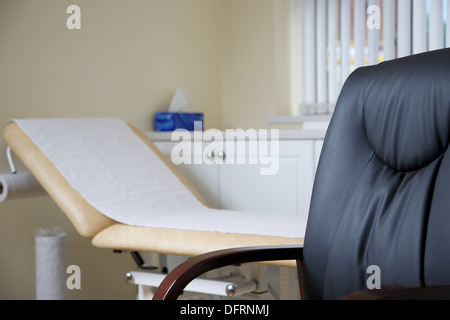 Interior of a GP doctor's surgery with an empty chair and bed Stock ...