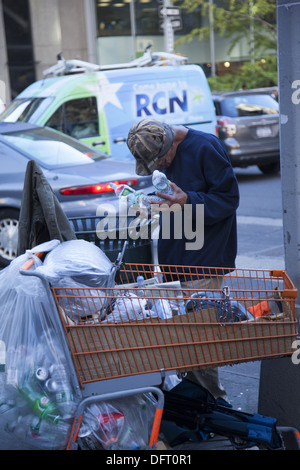 Garbage man with trash cans Stock Photo - Alamy