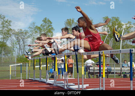 Young boy athlete jumping hurdles Stock Photo: 14624174 - Alamy