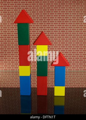Wooden blocks with arrows pointing upwards. Hand selecting one block ...
