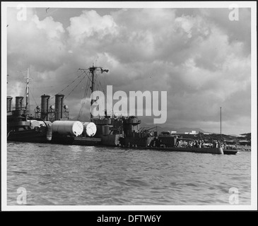 This photo captures a Pearl Harbor memorial ceremony aboard the USS ...