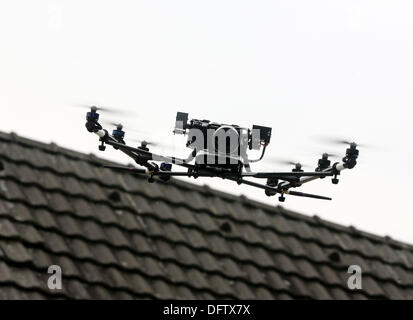 A type 'Asctec Falcon 8' micro unmanned aerial vehicle (UAV) is airborn ...