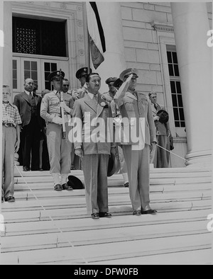 This photograph shows Prince Abdul Ilah of Iraq shaking hands with an ...