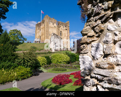 Guildford Castle flying the Union Jack flag with formal summer gardens ...