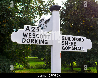 Traditional rural English road sign pointing toward Corfe Castle ...