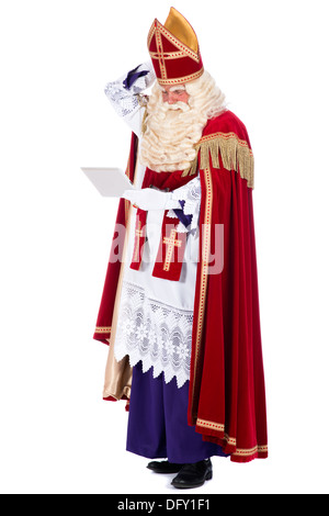 Modern Sinterklaas using a tablet instead of his book Stock Photo - Alamy
