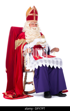 Sinterklaas is resting on his chair, drinking a cup of coffee Stock ...