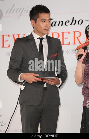 Taipei, China. 8th Oct, 2013. Actor Mark Chao presents commercial ...
